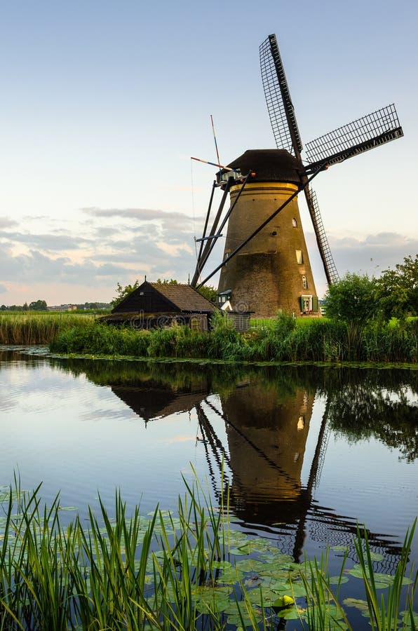 Historic Windmill at Sunset Stock Photo - Image of architecture, green ...