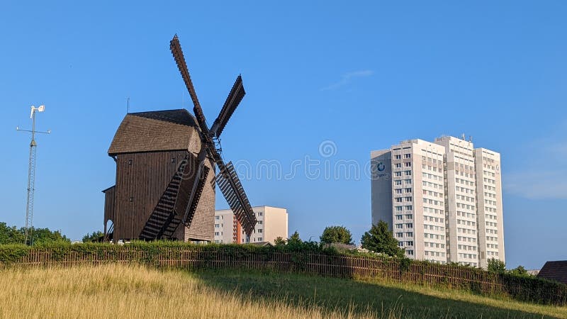 Historical German Windmill on the Hill and the Tower of Modern City ...