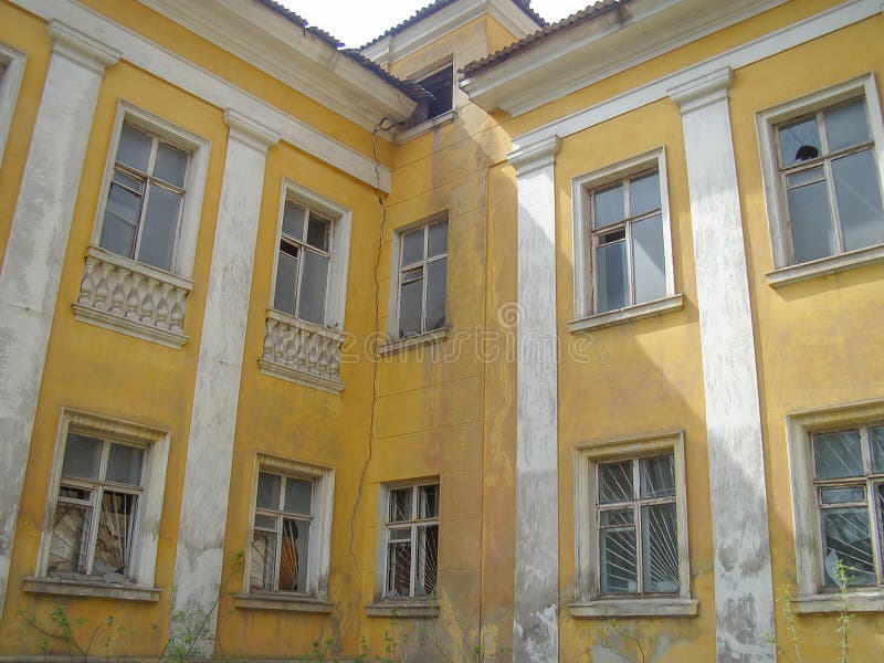 A Historical, Weathered Multi-story Building with Rectangular Windows ...