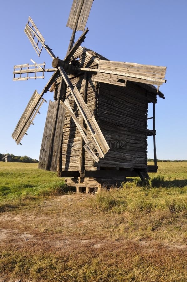 History. Ancient Windmill As in Old Fairytale in the Green Meadow Stock ...