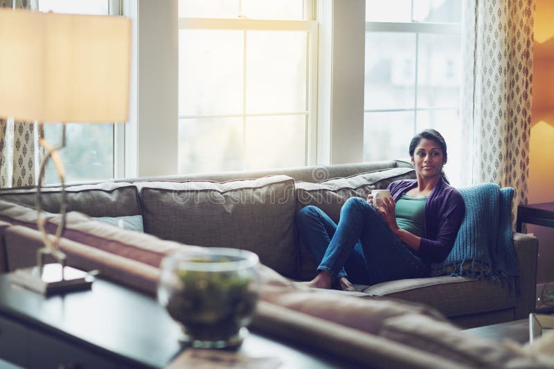 Hit the Pause Button, Have a Coffee Break. a Young Woman Relaxing on ... Hit the Pause Button, Have a Coffee Break. a Young Woman Relaxing on ...