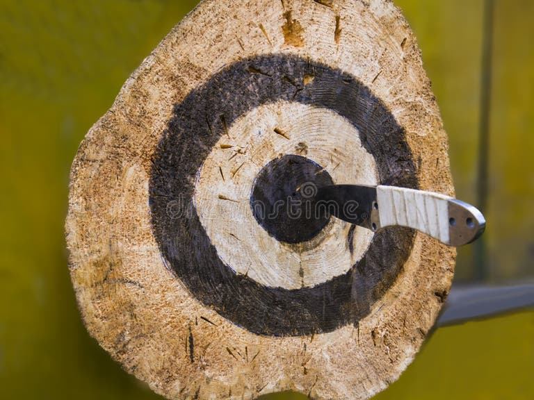 Throwing Knives in the Open Air Stock Photo - Image of target, tree ...