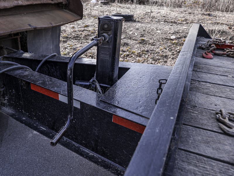 Hitch and Crank on the Front of a Flatbed Trailer Attached To a Truck ...