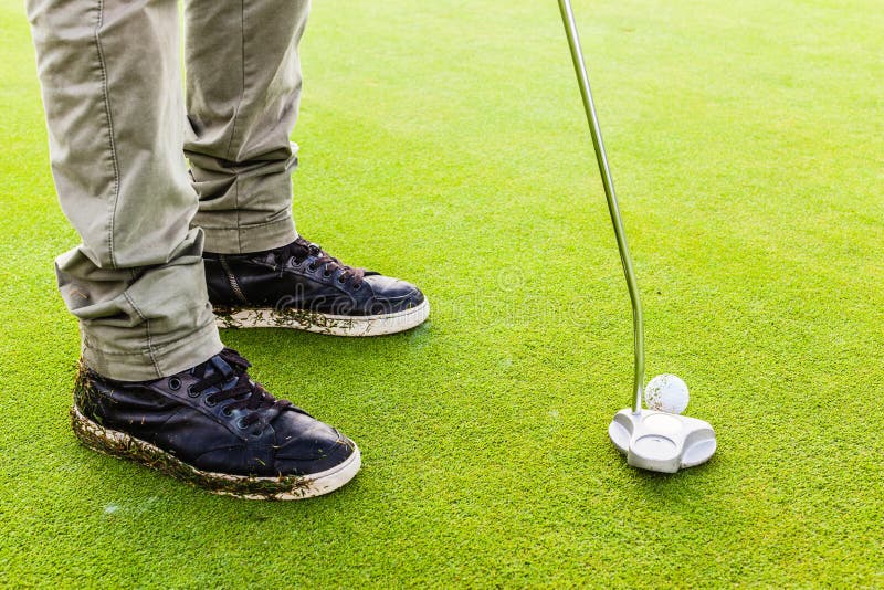 Hitting a Golf Ball with a Putter Club Stock Image - Image of outdoors ...