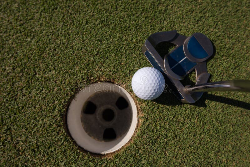 Hitting golf ball to hole stock photo. Image of space - 72381144