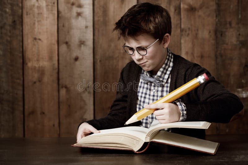 Hmm, this is a Tricky Problem...Young Boy Wearing Glasses and Doing His ... Hmm, this is a Tricky Problem...Young Boy Wearing Glasses and Doing His ...