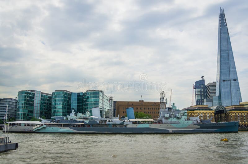 HMS Belfast Museum Ship and the Shard in London, England Editorial ...