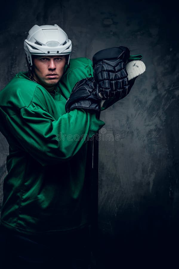 Hockey Player In Protective Clothes Holds Playing Stick. Stock Image ... Hockey Player In Protective Clothes Holds Playing Stick. Stock Image ...