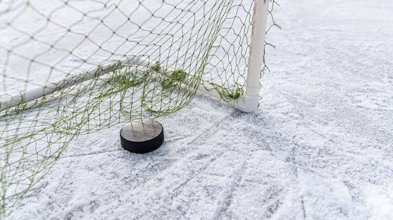 Hockey Puck in the Goal Net Close-up Stock Photo - Image of cold ...