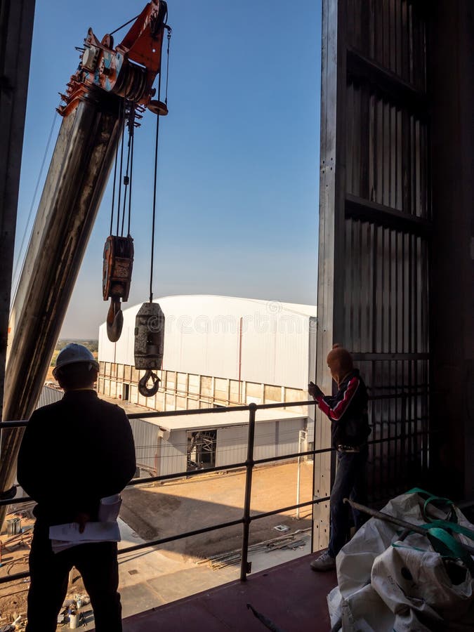 Hoist of Crane at the Window of Industrial Plant Editorial Photography ...