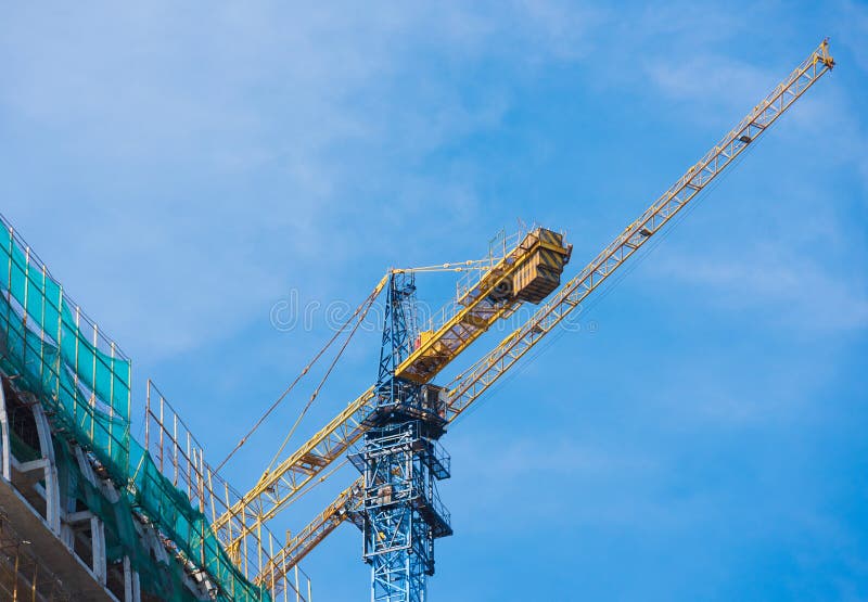 Hoisting Crane at Contstruction Stock Image - Image of outdoors, green ...
