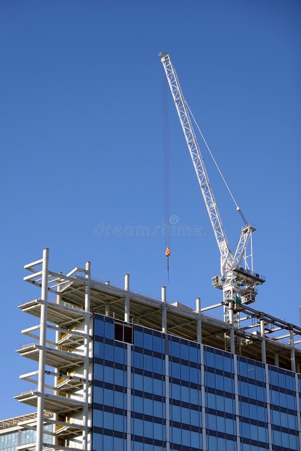 Hoisting Tower Crane on the Top Section Being Constructed of Modern ...