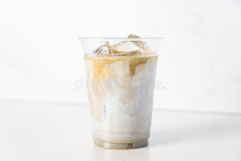 Hojicha tea latte in glass stock image. Image of marble - 266454485