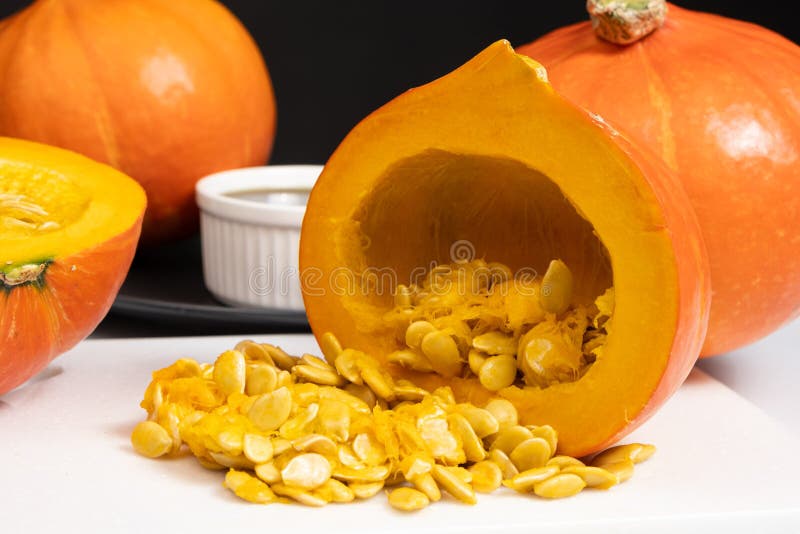 Hokkaido Pumpkin Seed Extraction. Pumpkin Inside with Raw Seeds Stock ...
