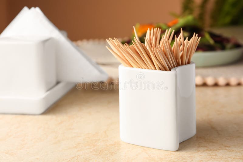Holder with Many Toothpicks on Beige Table, Closeup. Space for Text ...
