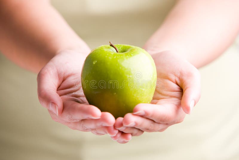Holding Apple stock image. Image of holding, young, hands - 1296381
