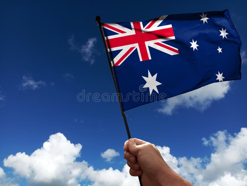 Holding Australian Flag Waving Under Cloudy Sky. Stock Image - Image of ...