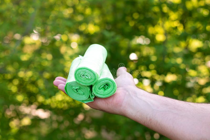 Holding Bio Eco Plastic Garbage Bags in Rolls Stock Image - Image of ...