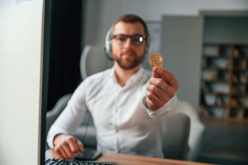 Holding Bitcoin in the Hand. Man in Formal Clothes is Working in the ...