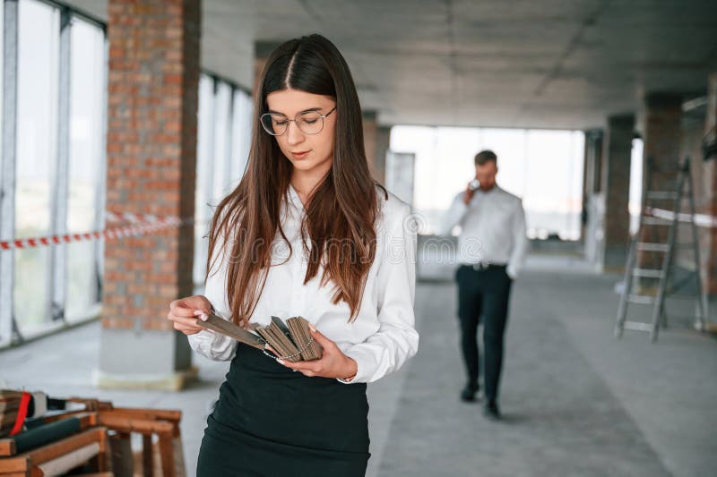 Holding and Choosing Different Colored Materials. Industry Workers are ...