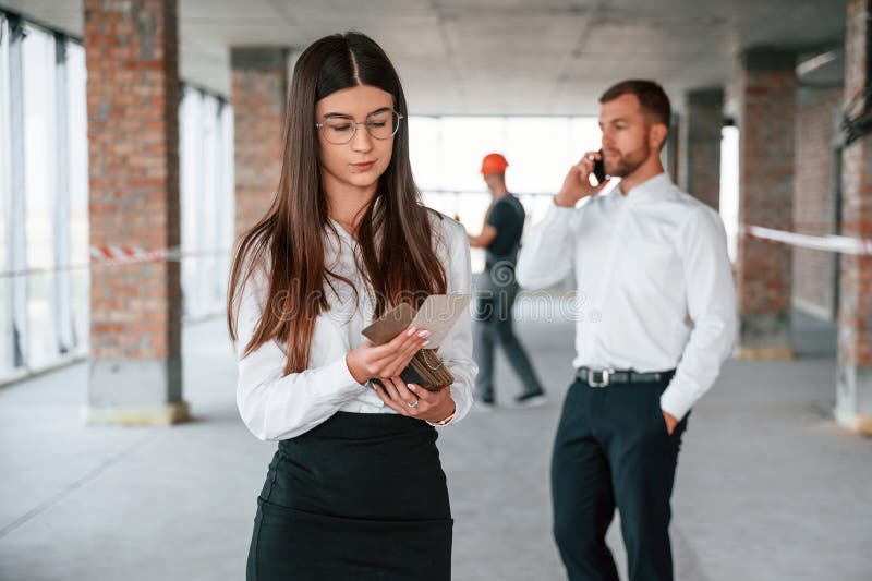 Holding and Choosing Different Colored Materials. Industry Workers are ...