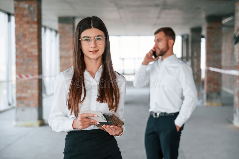 Holding and Choosing Different Colored Materials. Industry Workers are ...