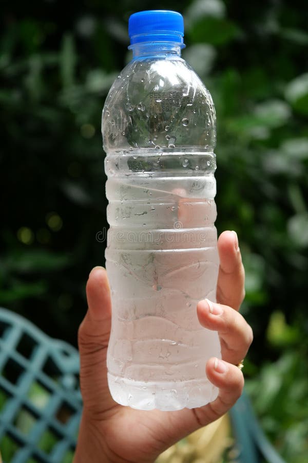 Holding a Cold Mineral Water Bottle Outdoor Stock Image - Image of cold ...