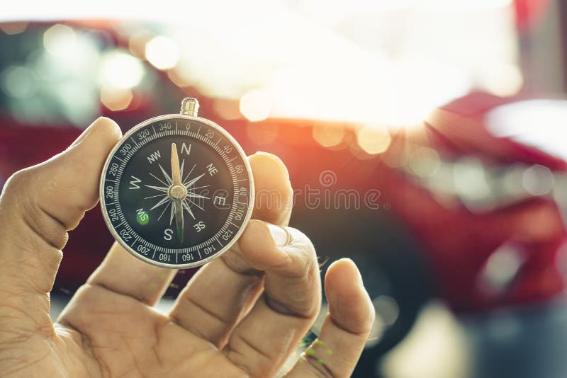 Holding Compass on Blurred Background. Using Wallpaper or Backgr Stock ...