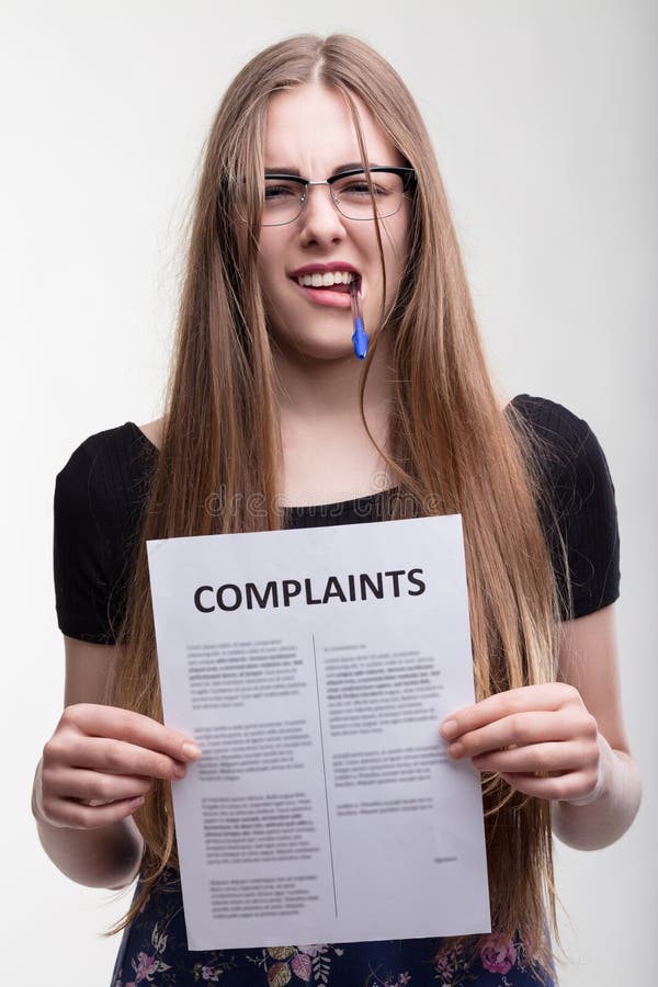 Holding Complaints, she Embodies Focused Problem-solving Stock Image ...