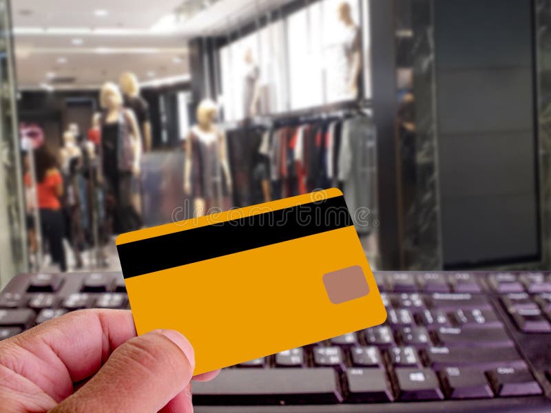 Holding Credit Card and Using the Computer Stock Photo - Image of face ...