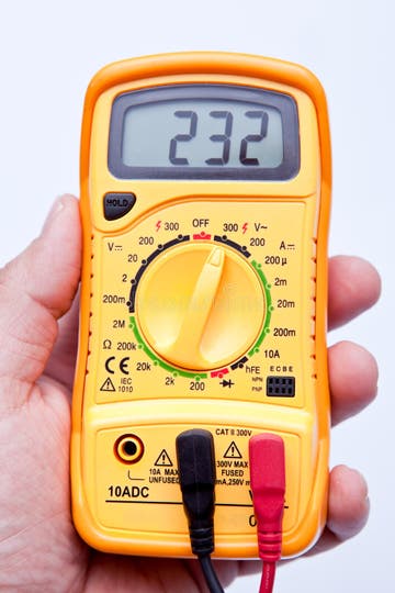 Holding digital multimeter stock image. Image of power - 31675429