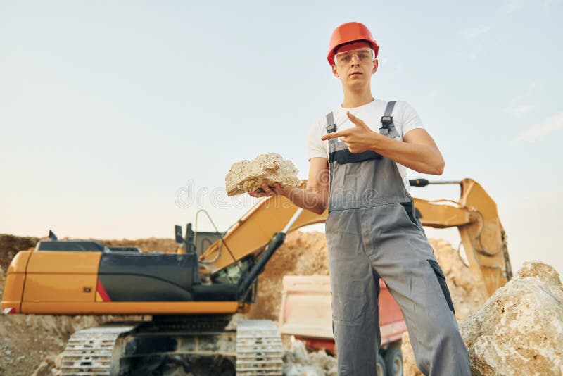 Holding Documents in Hands. Worker in Professional Uniform is on the ...