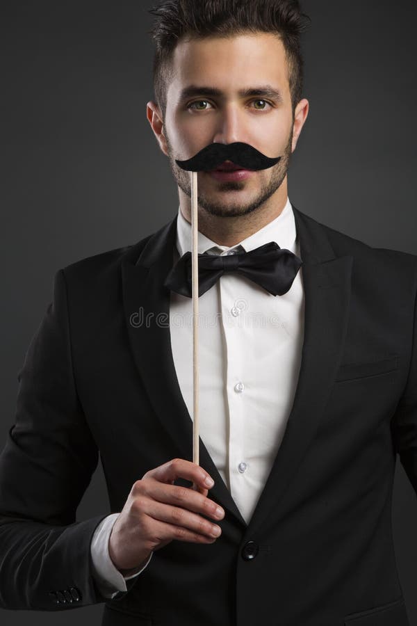 Holding a fake mustache stock photo. Image of caucasian - 85286568