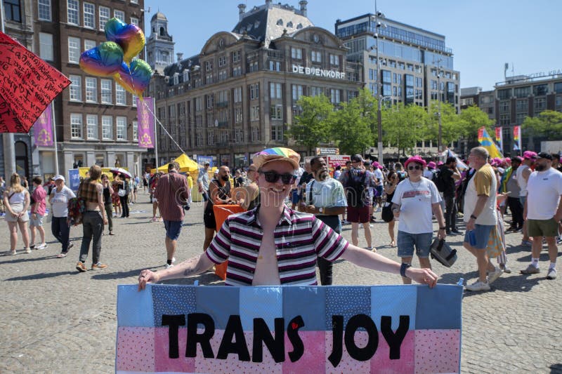 Holding a Flag with the Text Trans Joy is Trans Power at Pride Walk at ...