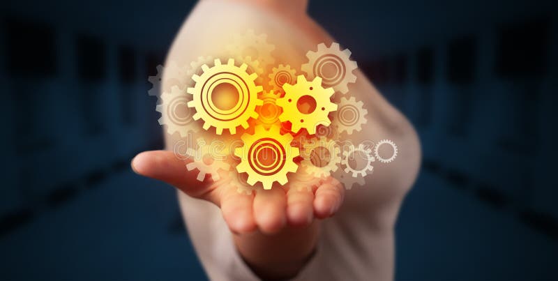 Holding gears in his hand stock photo. Image of adult - 152591626