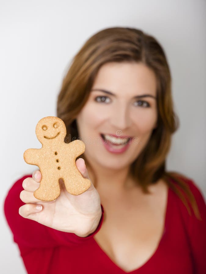 Holding a Gingerbread Cookie Stock Image - Image of girl, adult: 17353679