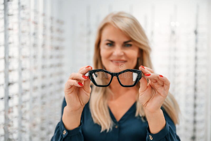 Holding Glasses in Hands. Woman is in the Store Stock Photo - Image of ...