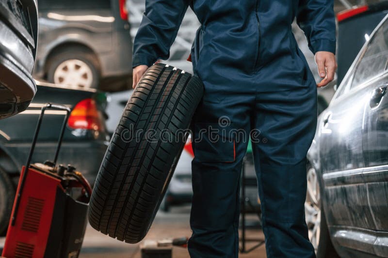 Holding it in Hand. Close Up View of Man that is Moving Tire of the Car ...