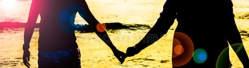 Holding Hands Against Sunset Over Stock Photo - Image of sunset, ocean ...