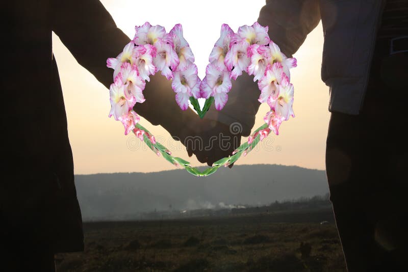 Holding Hands Embraced with Heart Made of Flower Stock Image - Image of ...