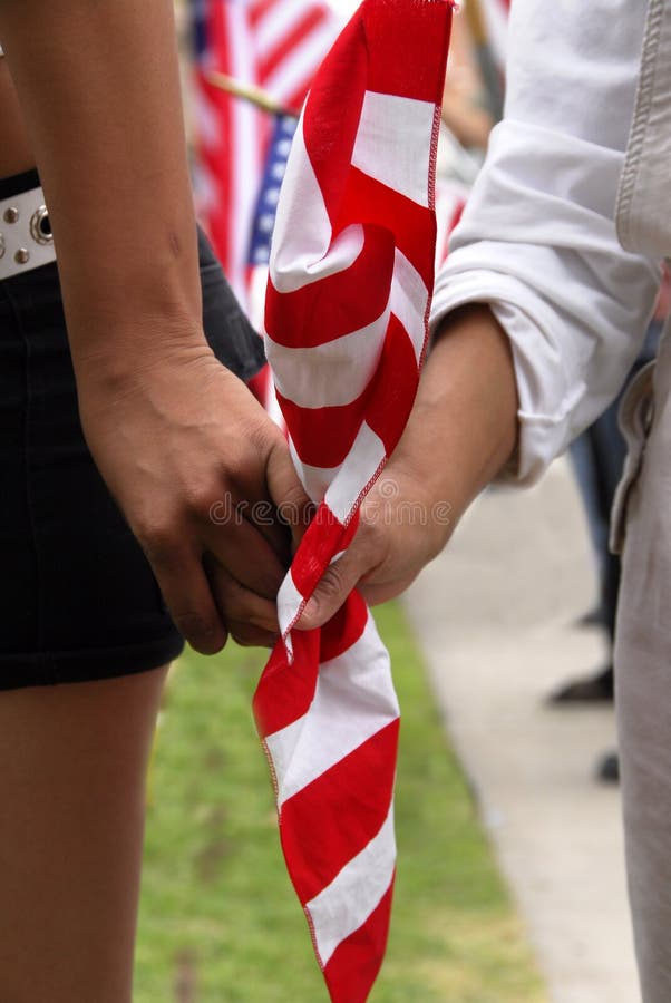 Holding hands and the flag stock image. Image of immigration - 778983