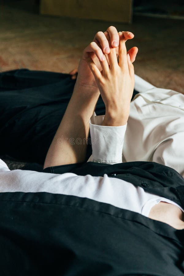 Holding Hands. Lovers Couple Holding Hands in a Room Stock Photo ...