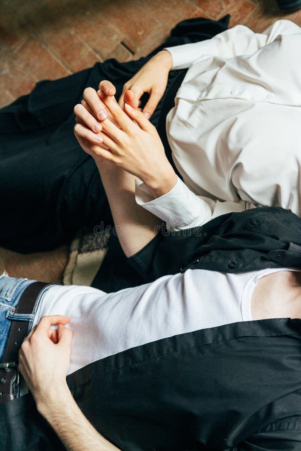 Holding Hands. Lovers Couple Holding Hands in a Room. Hand in Hand ...