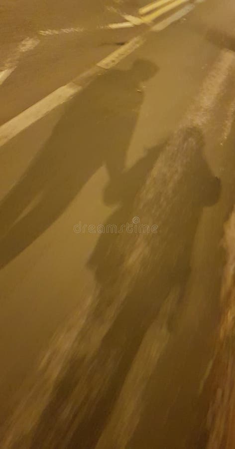 Holding hands shadows stock image. Image of flooring - 205531471