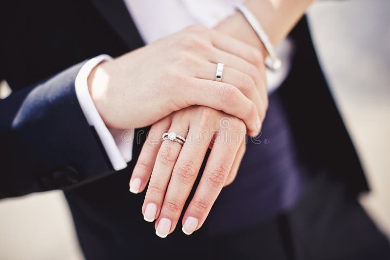 Holding Hands with Wedding Rings Stock Photo - Image of adults ... Holding Hands with Wedding Rings Stock Photo - Image of adults ...