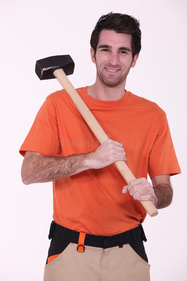 Holding a huge hammer stock photo. Image of professional - 33681546