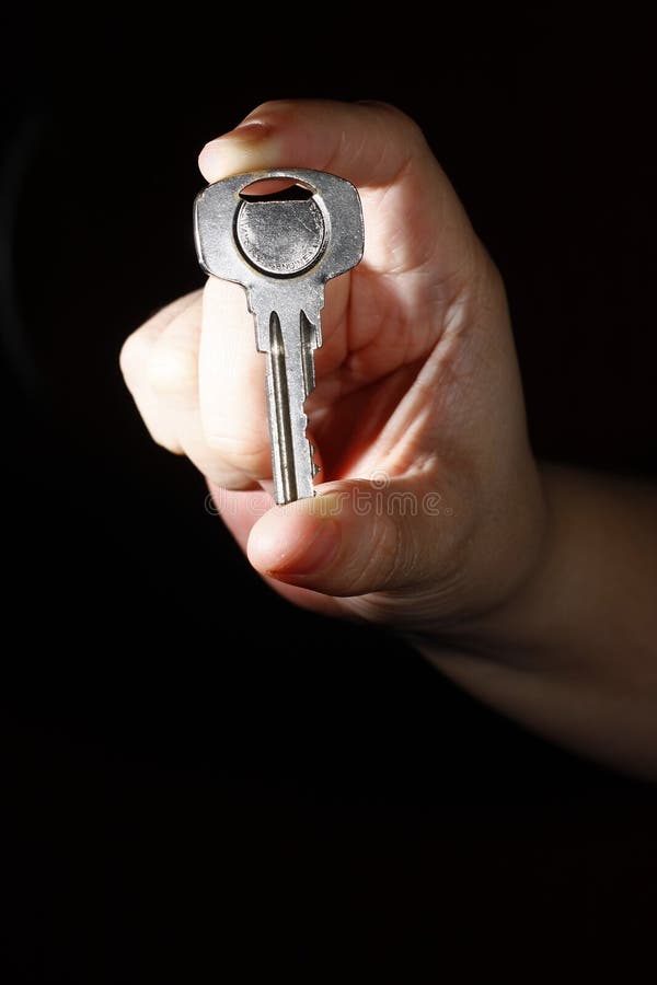Holding a Key stock photo. Image of unlock, give, offering - 22642760