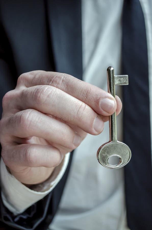 Holding a key stock photo. Image of give, holding, hand - 28349276