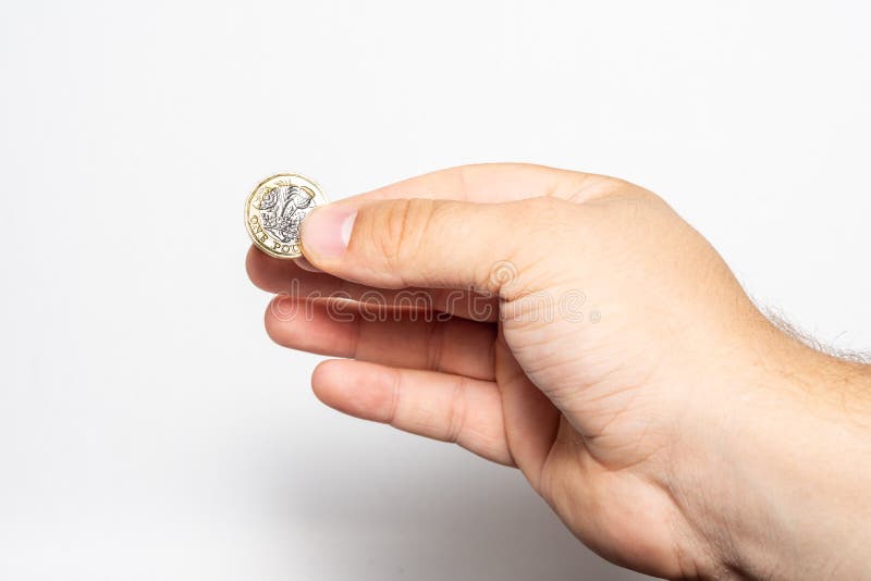 Holding one pound in hand stock image. Image of closeup - 158511733
