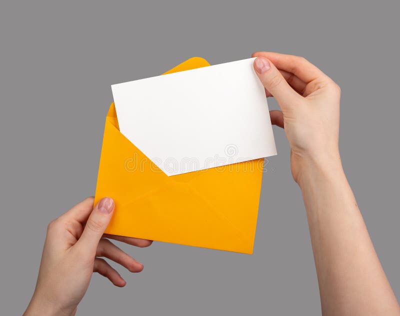 Holding an Open Envelope with a White Card Inside, Blank Horizontal ...